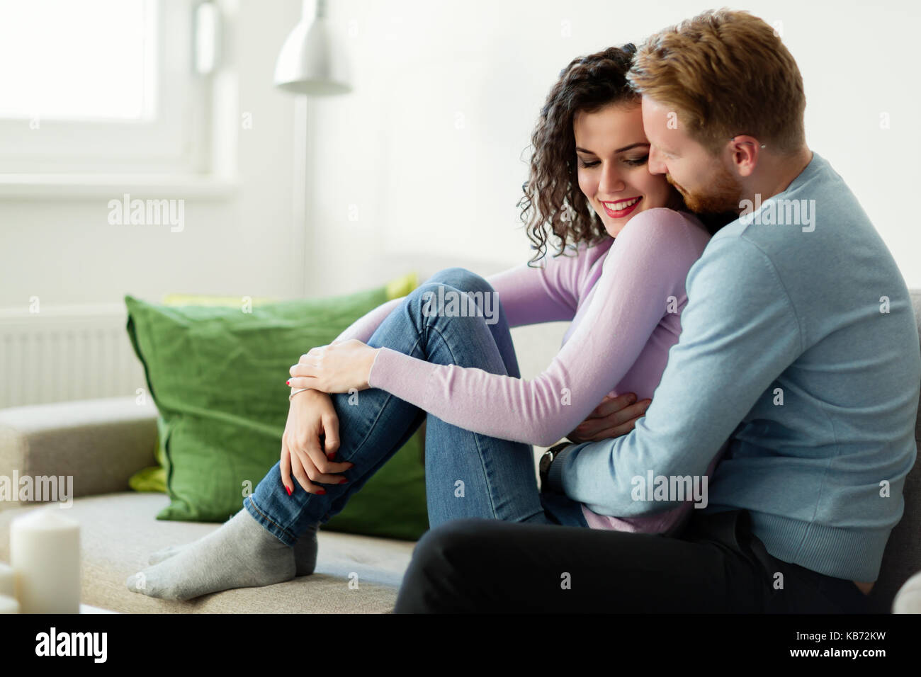Young happy couple having romantic times at home Stock Photo - Alamy