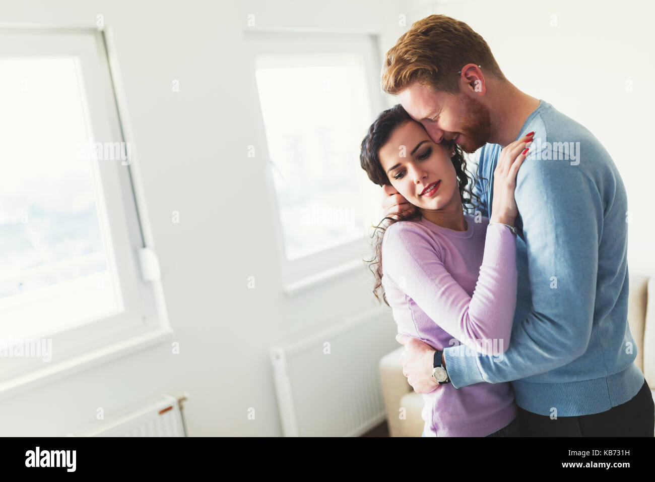 Young happy couple having romantic times at home Stock Photo - Alamy