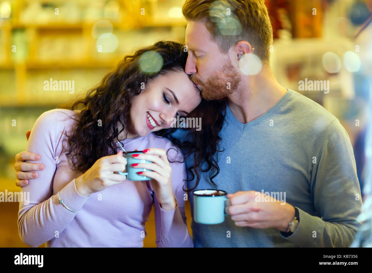 Romantic couple having date in coffee shop Stock Photo - Alamy