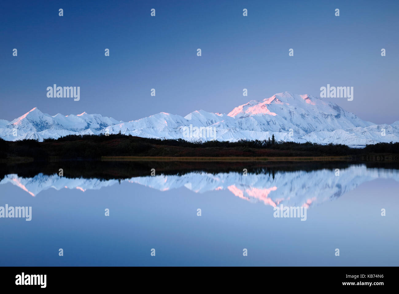 Denali, reflected in Reflection Pond, also known as Mount McKinley, its ...