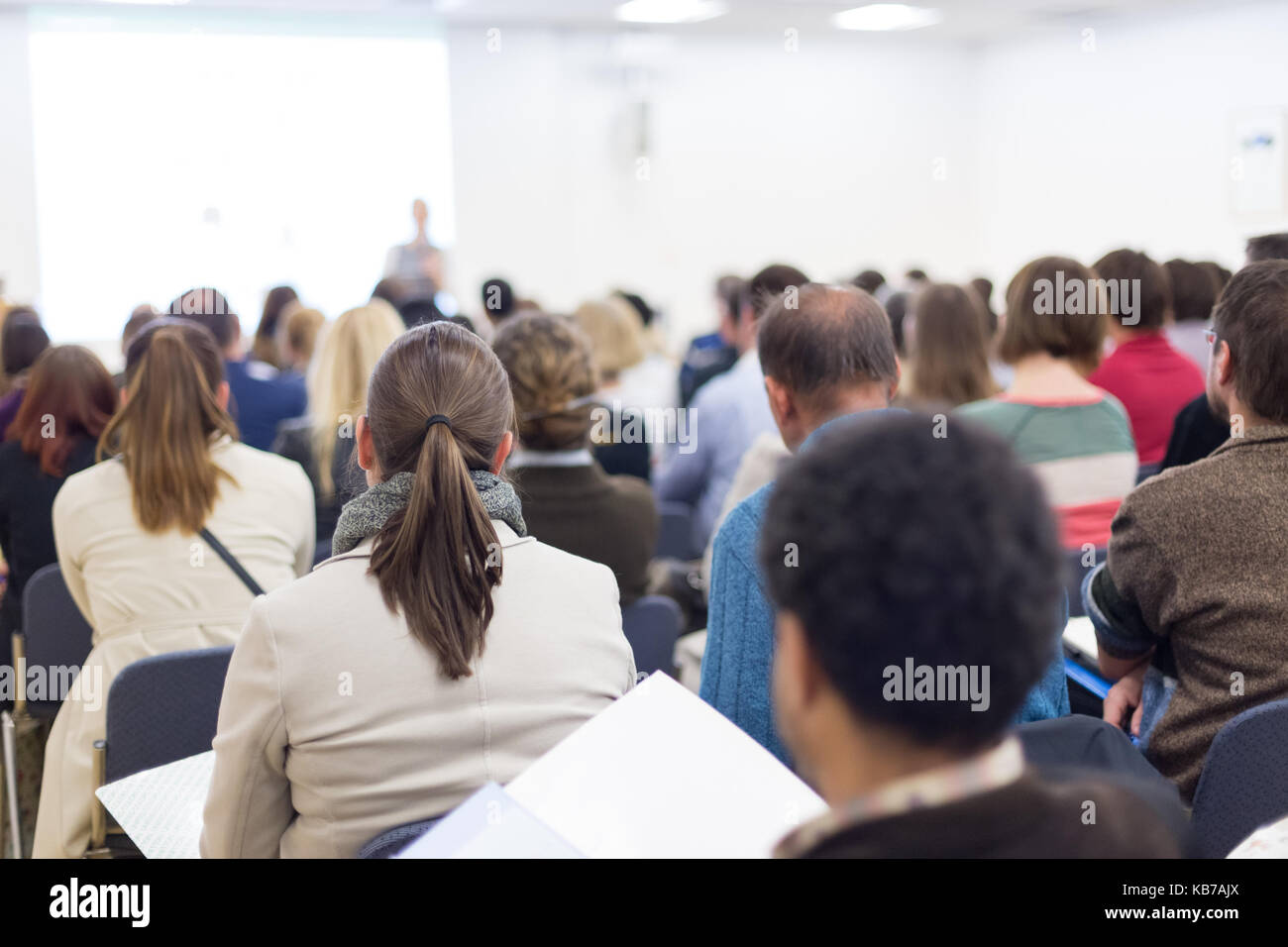 Woman giving presentation on business conference Stock Photo - Alamy