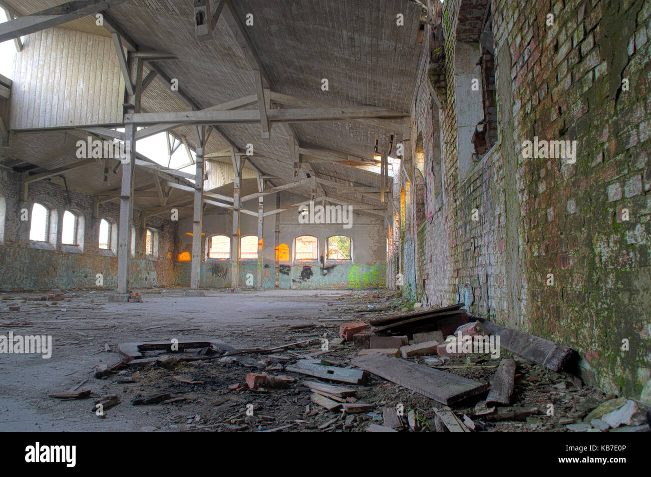 Destroyed warehouse – part of ruined factory hall. Forgotten industrial ...