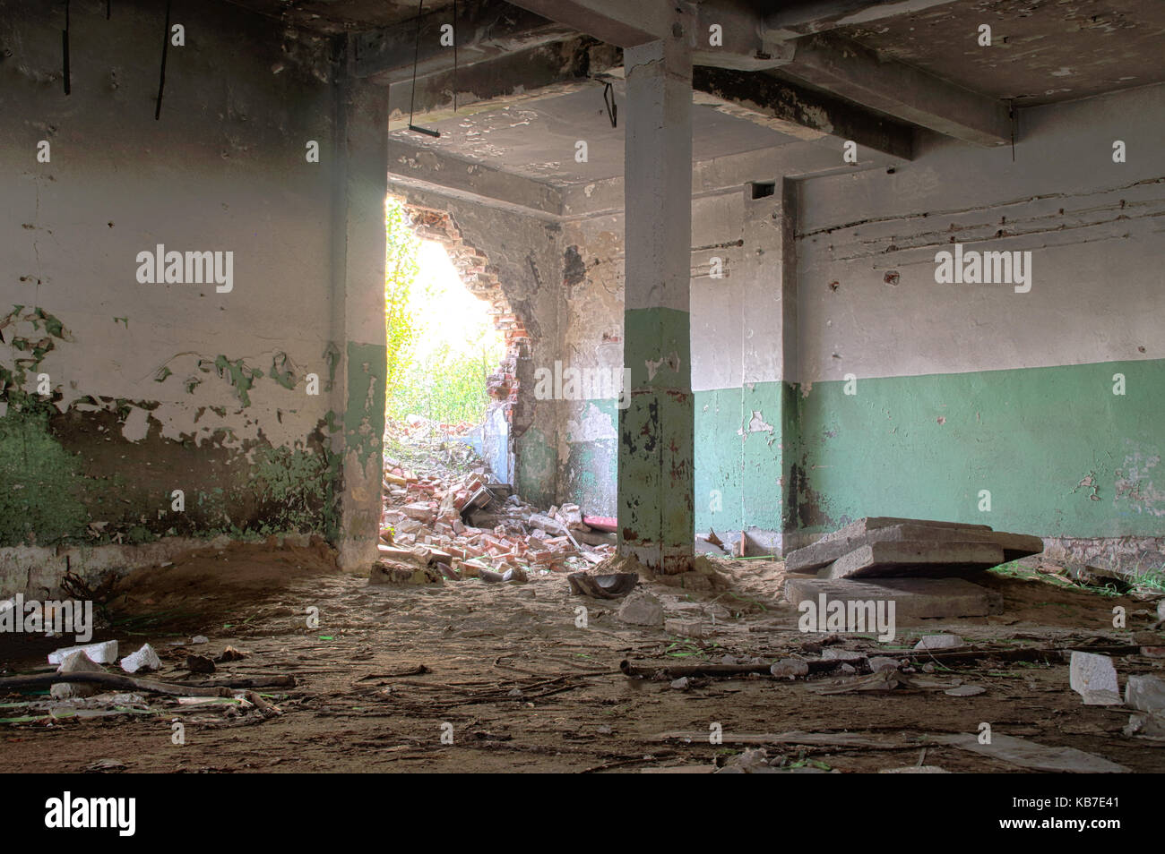 Destroyed warehouse – part of ruined factory hall. Forgotten industrial ...