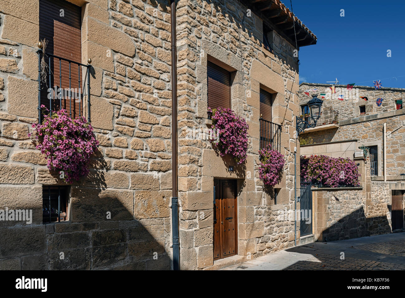 Beautiful stone house with beautiful latticed balconies from where pots ...