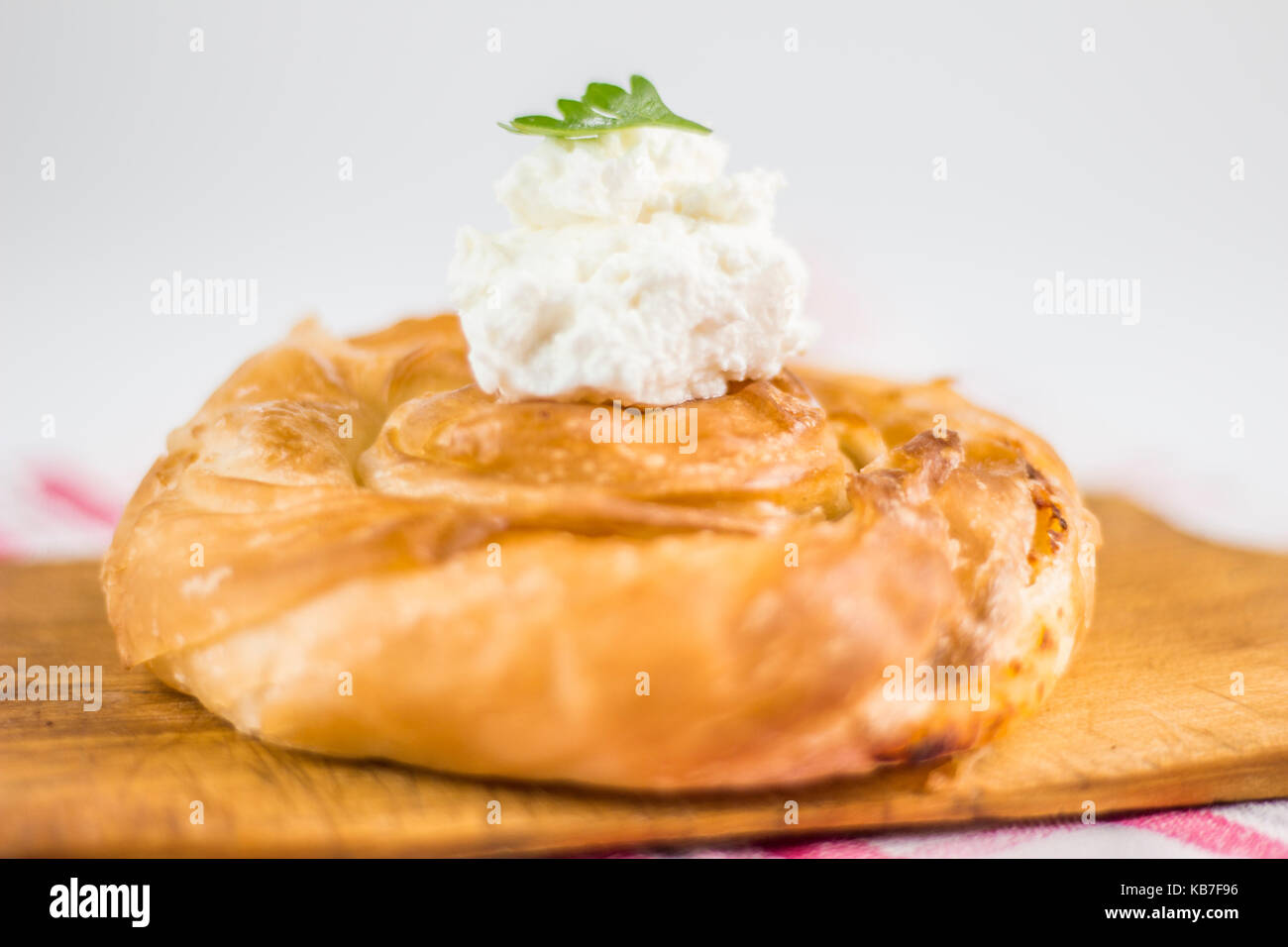 Cheese burek/sirnica composition on white background Stock Photo - Alamy