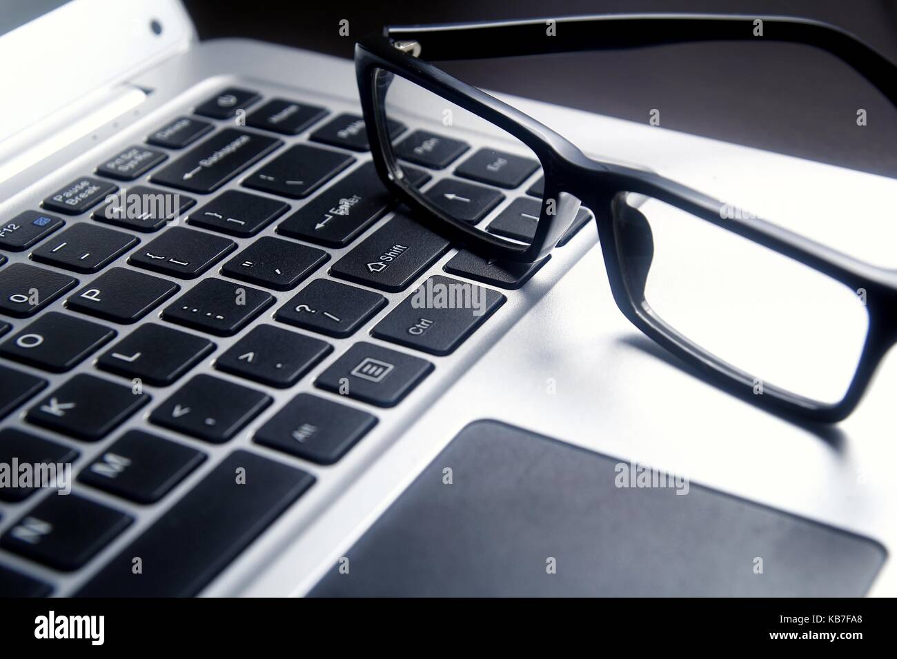 Spectacle glasses on laptop keyboard hi-res stock photography and ...