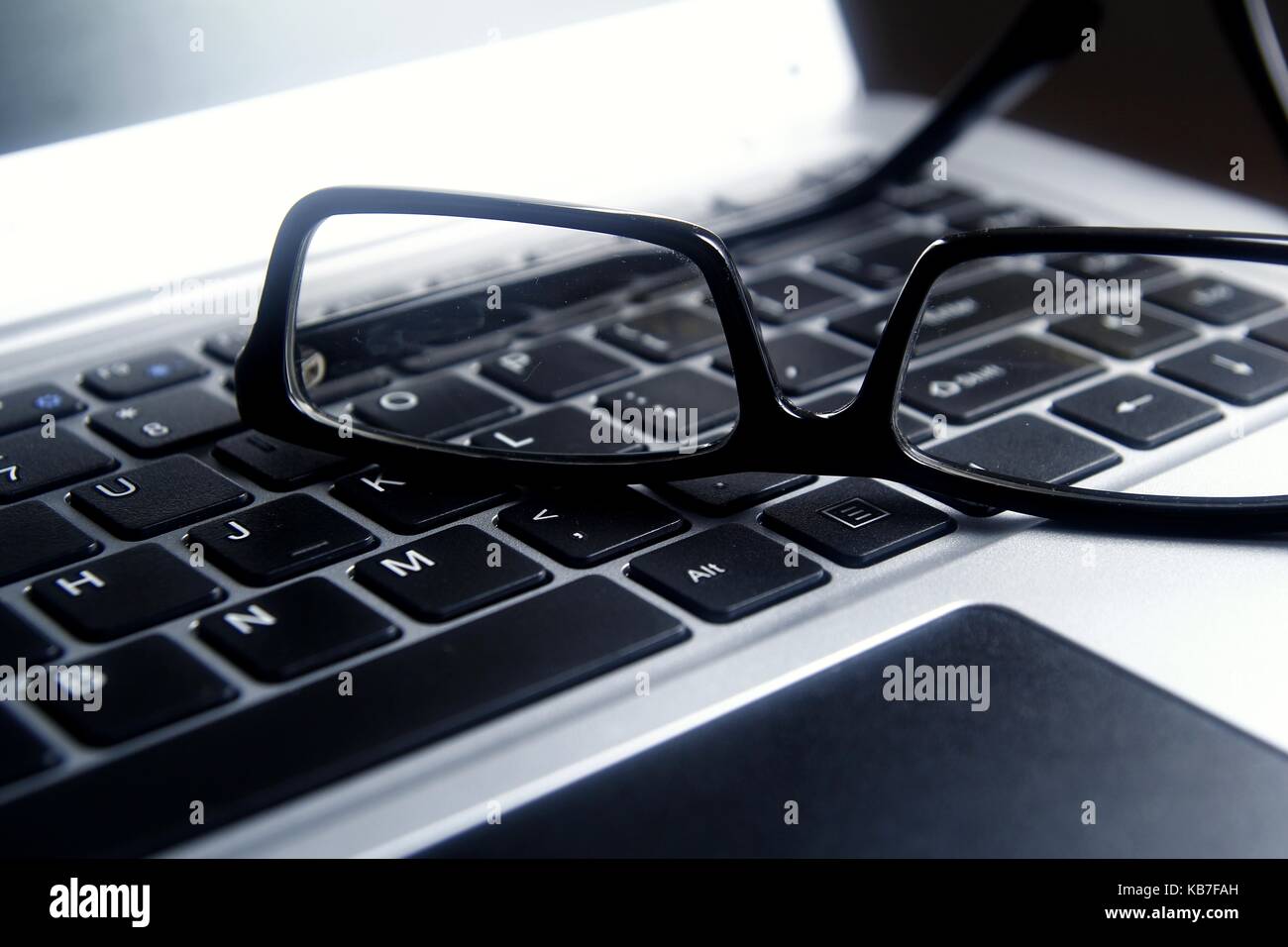 Spectacle glasses on laptop keyboard hi-res stock photography and ...