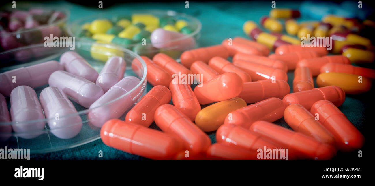 Many medicines pills capsules of diferent size Stock Photo - Alamy