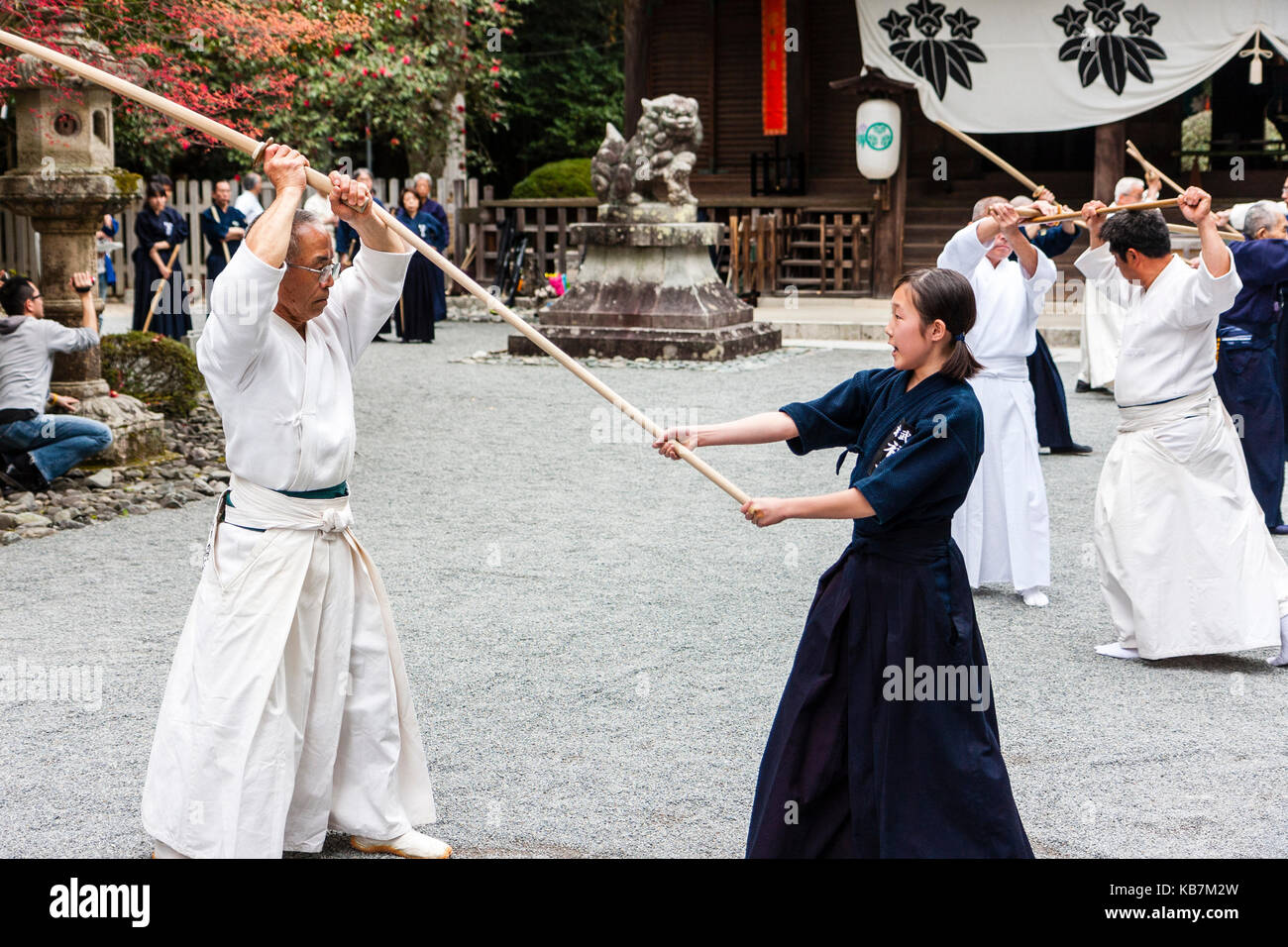 Japan, Osaka, Tada. Master samurai swordsman dressed in white fighting ...