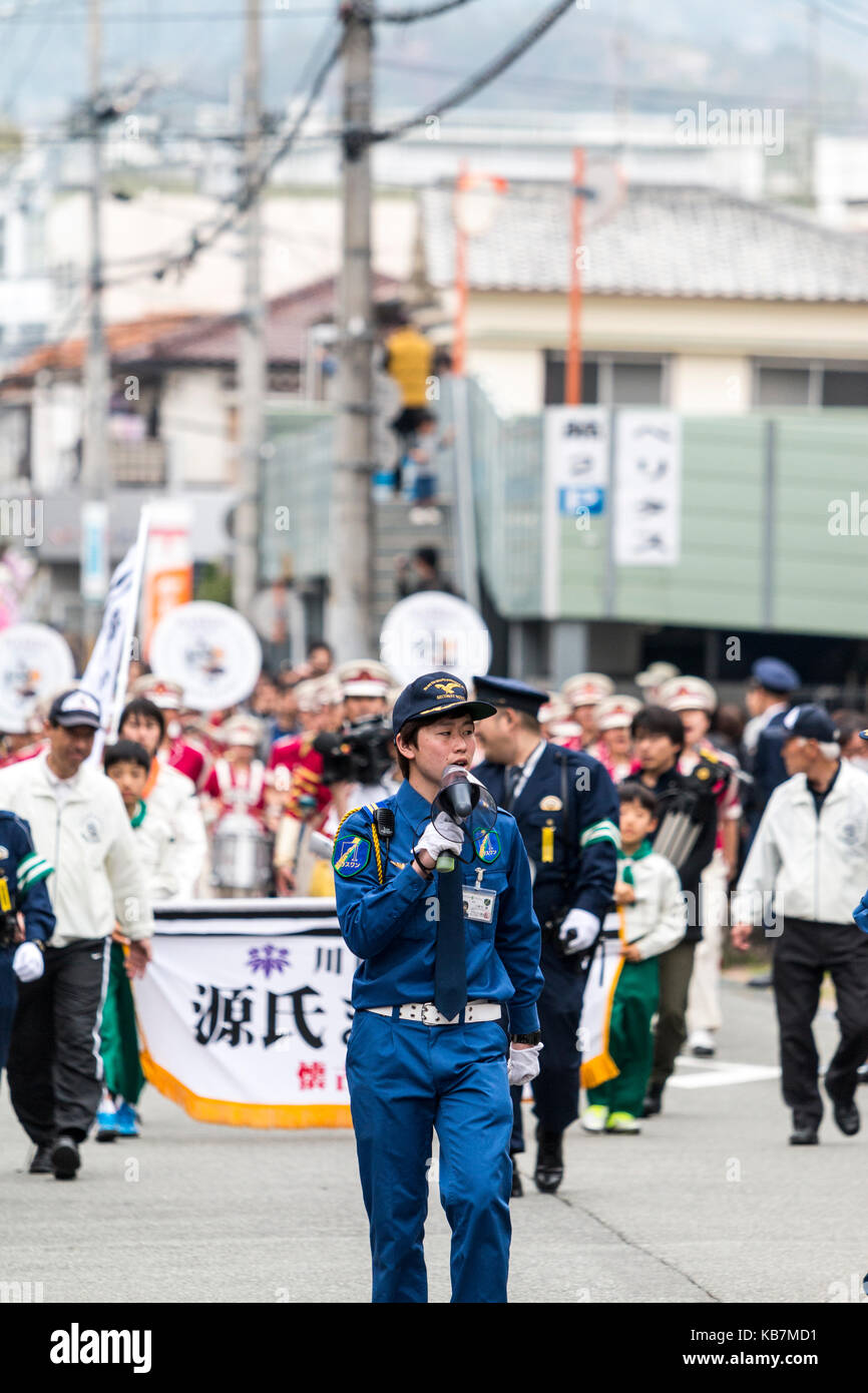 Japan, Osaka, Tada. Yearly Genji parade. Secuirty man leading the ...