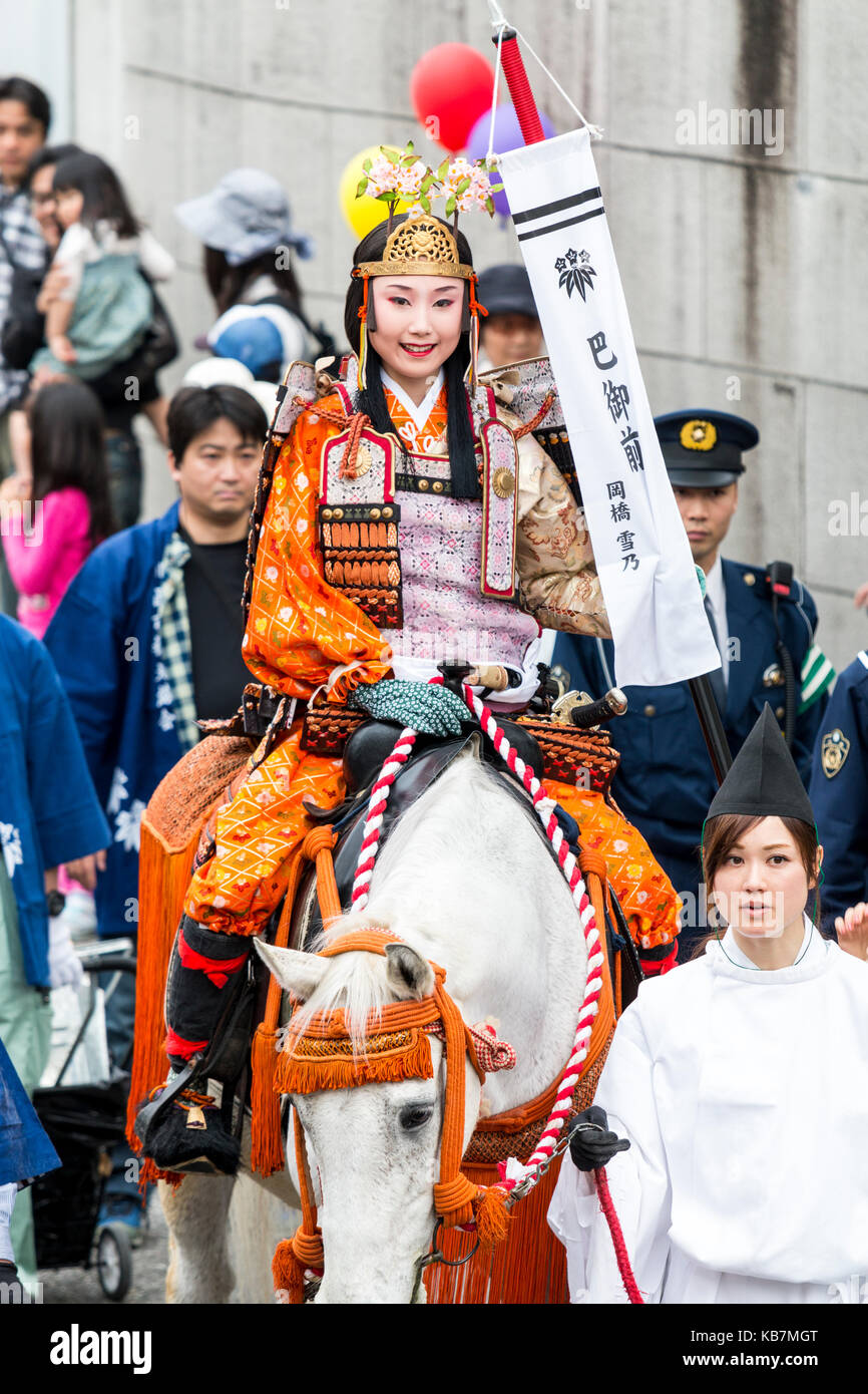 Japan, Osaka, Tada. Genji parade. Young Japanese women riding white ...