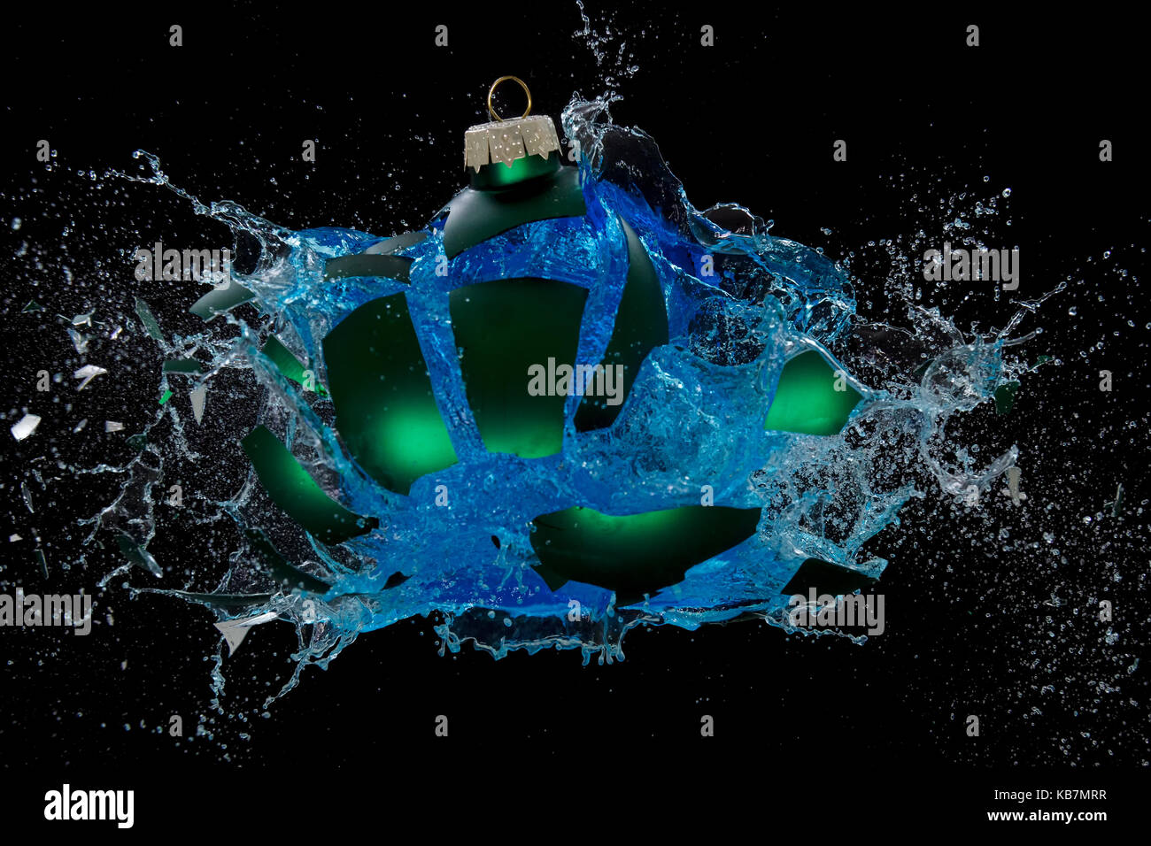 Bauble exploding, liquid splashing around Stock Photo - Alamy