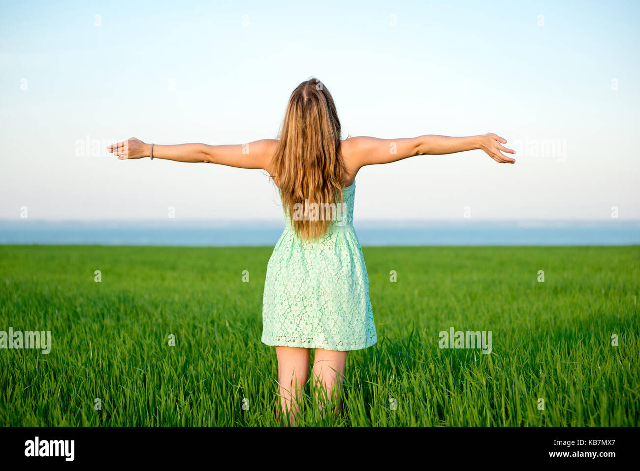 Happiness woman stay outdoor under sunlight of sunset Stock Photo - Alamy