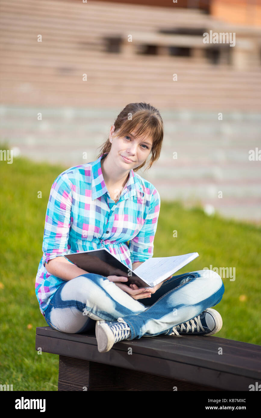 Girl on park bench hi-res stock photography and images - Alamy