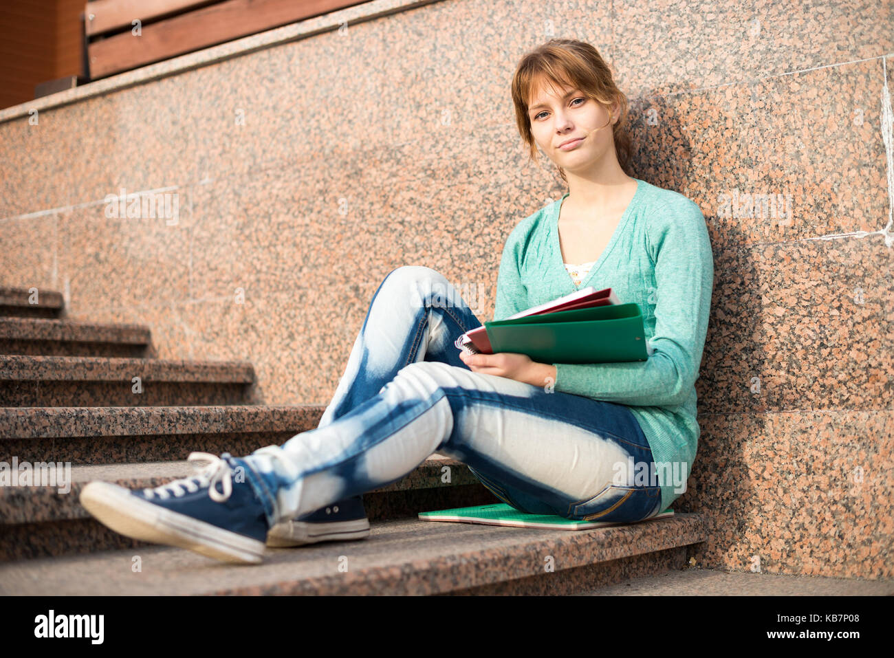 Teen girl sitting on stairs hi-res stock photography and images - Alamy