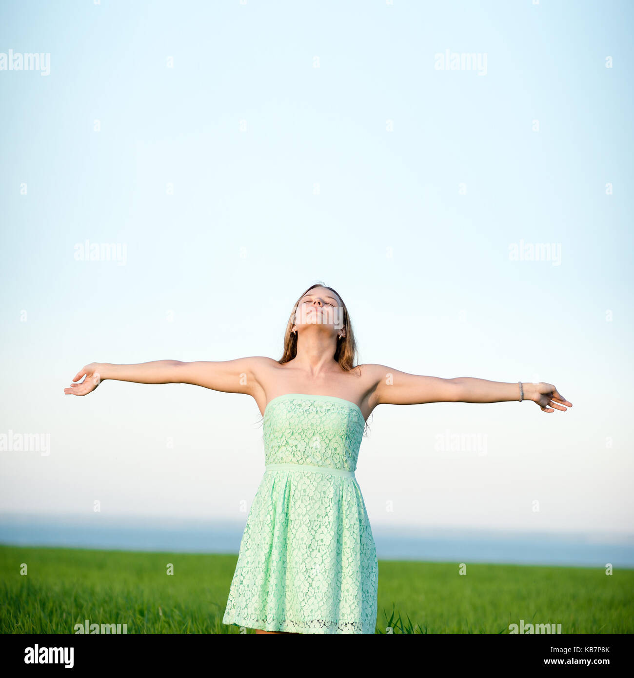 Happiness woman stay outdoor under sunlight of sunset Stock Photo - Alamy