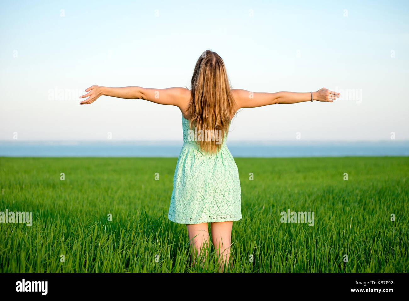 Happiness woman stay outdoor under sunlight of sunset Stock Photo - Alamy