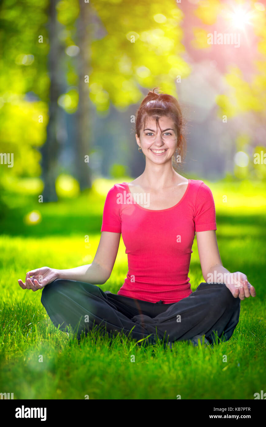 Young woman doing yoga exercises Stock Photo - Alamy