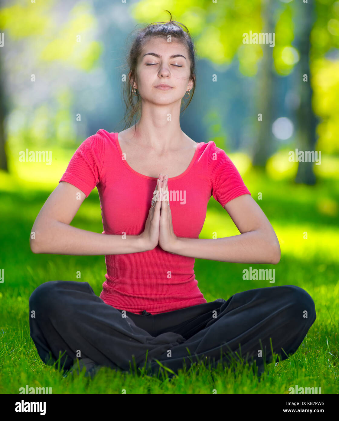 Young woman doing yoga exercises Stock Photo - Alamy