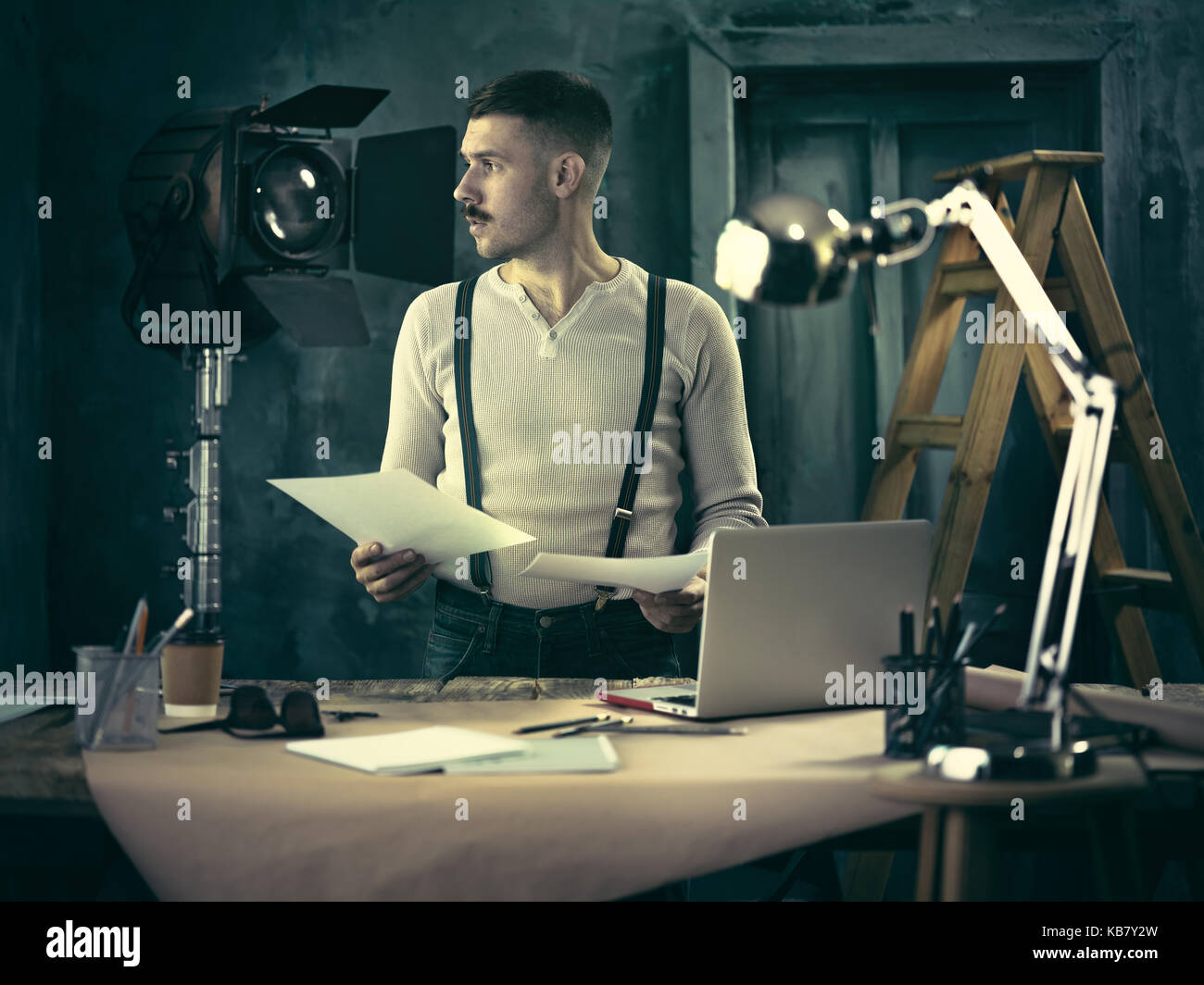 Architect working on drawing table in office Stock Photo - Alamy