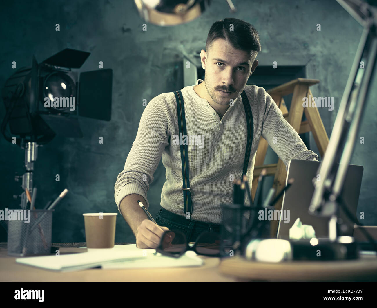 Architect working on drawing table in office Stock Photo - Alamy