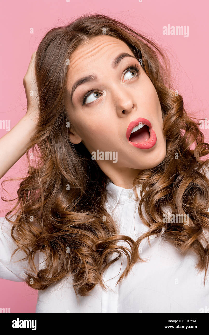 Surprised happy beautiful woman looking sideways in excitement Stock ...