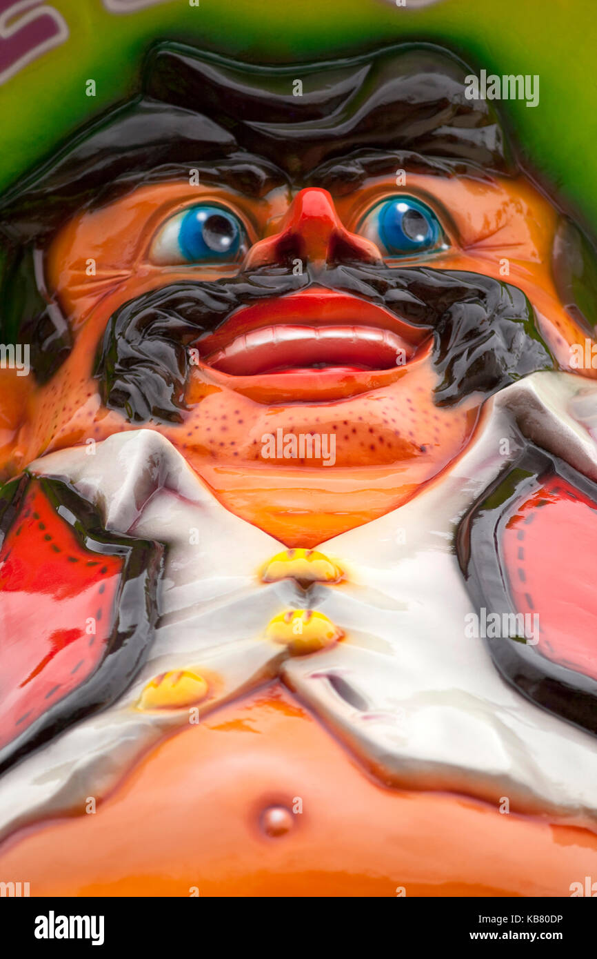 Plastic and colorful statue of a fat man Stock Photo - Alamy