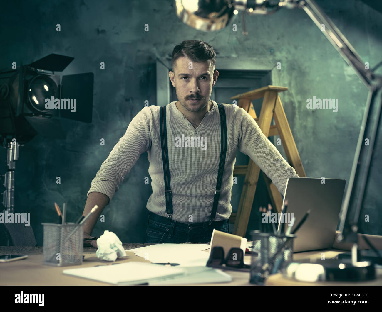 Architect working on drawing table in office Stock Photo - Alamy