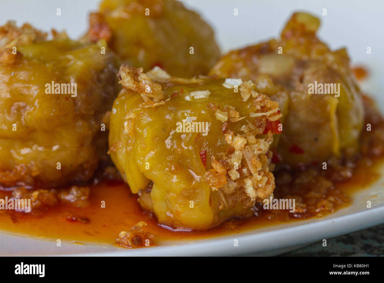 Shumai a steamed dumpling with sauce and fried garlic on top, popular ...