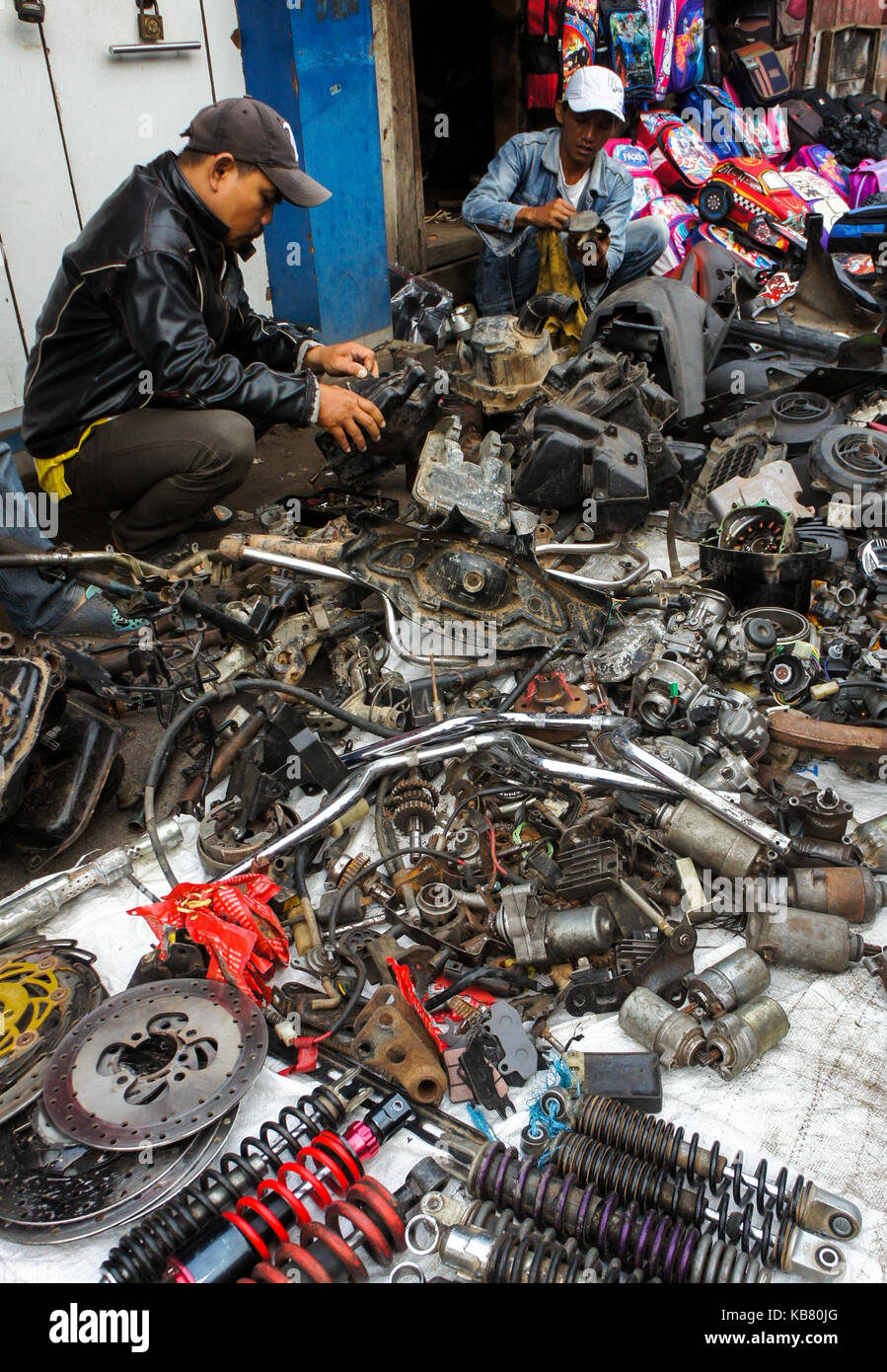 Street vendor sells used spareparts at morning market, Palembang City ...