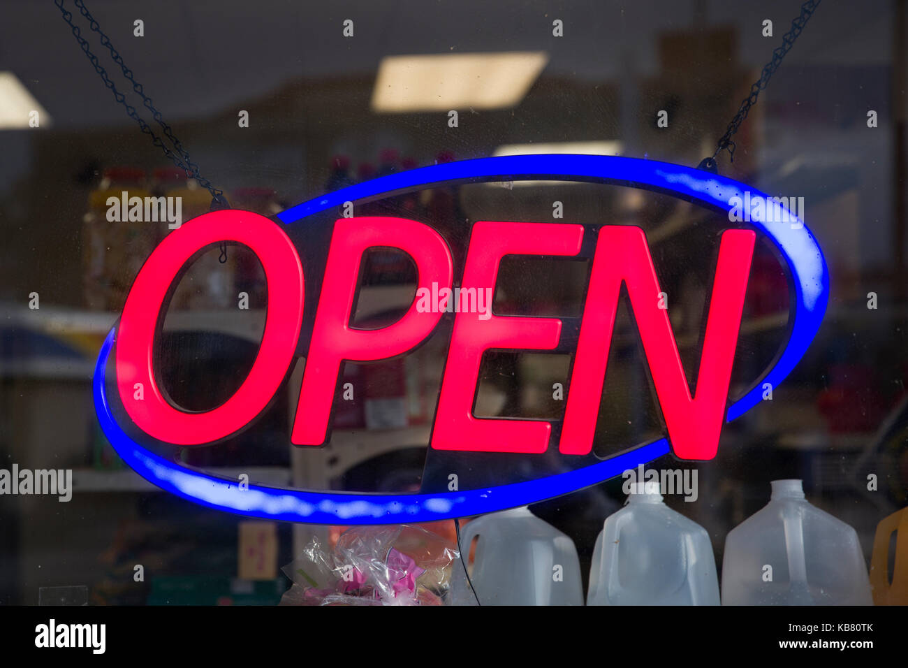 Red neon open sign in blue circle Stock Photo - Alamy