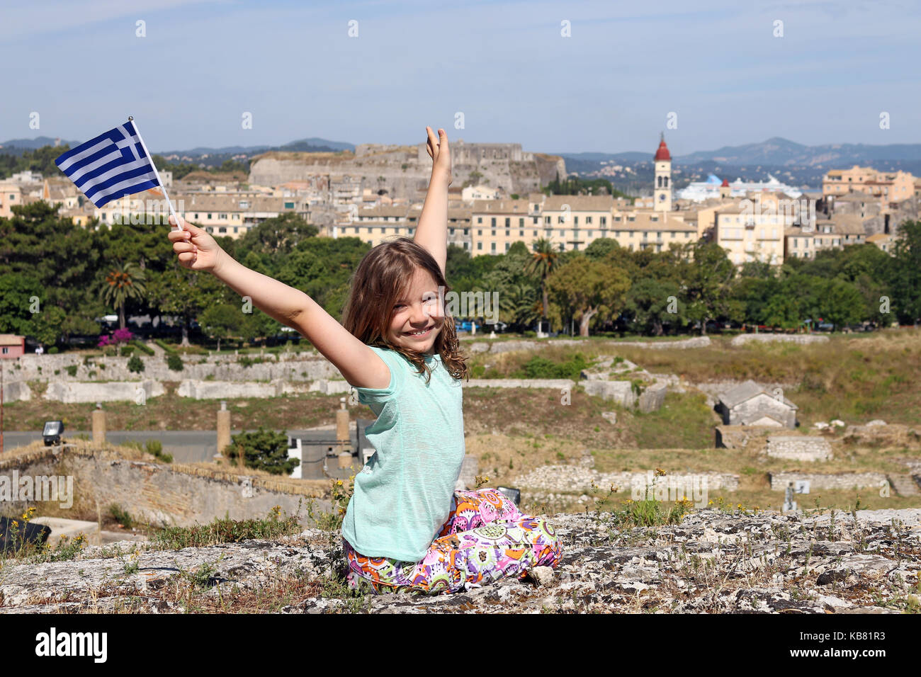happy little girl waving with Greek flag Corfu town Greece Stock Photo ...