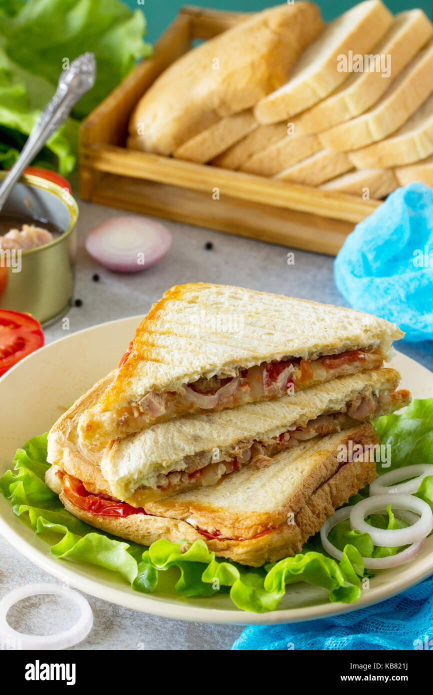 Double sandwich with canned tuna and feta cheese served with lettuce ...