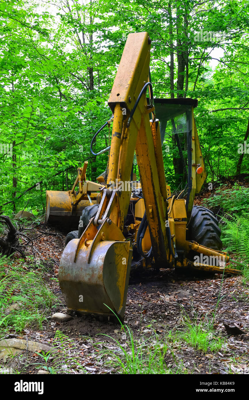 Old yellow backhoe parked in the Adirondack wilderness Stock Photo - Alamy