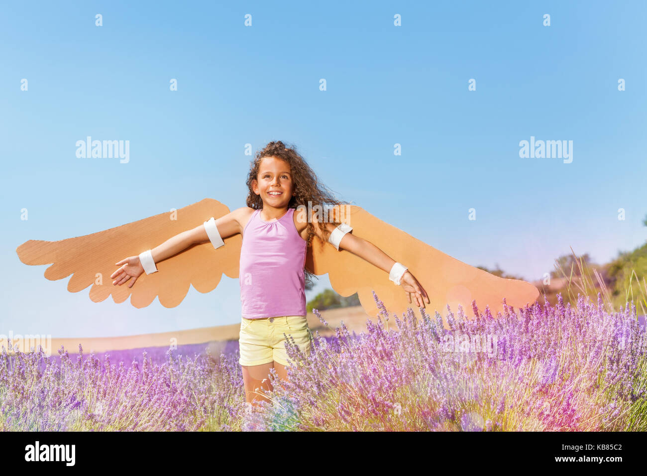 Happy little girl dreaming to become a bird Stock Photo - Alamy