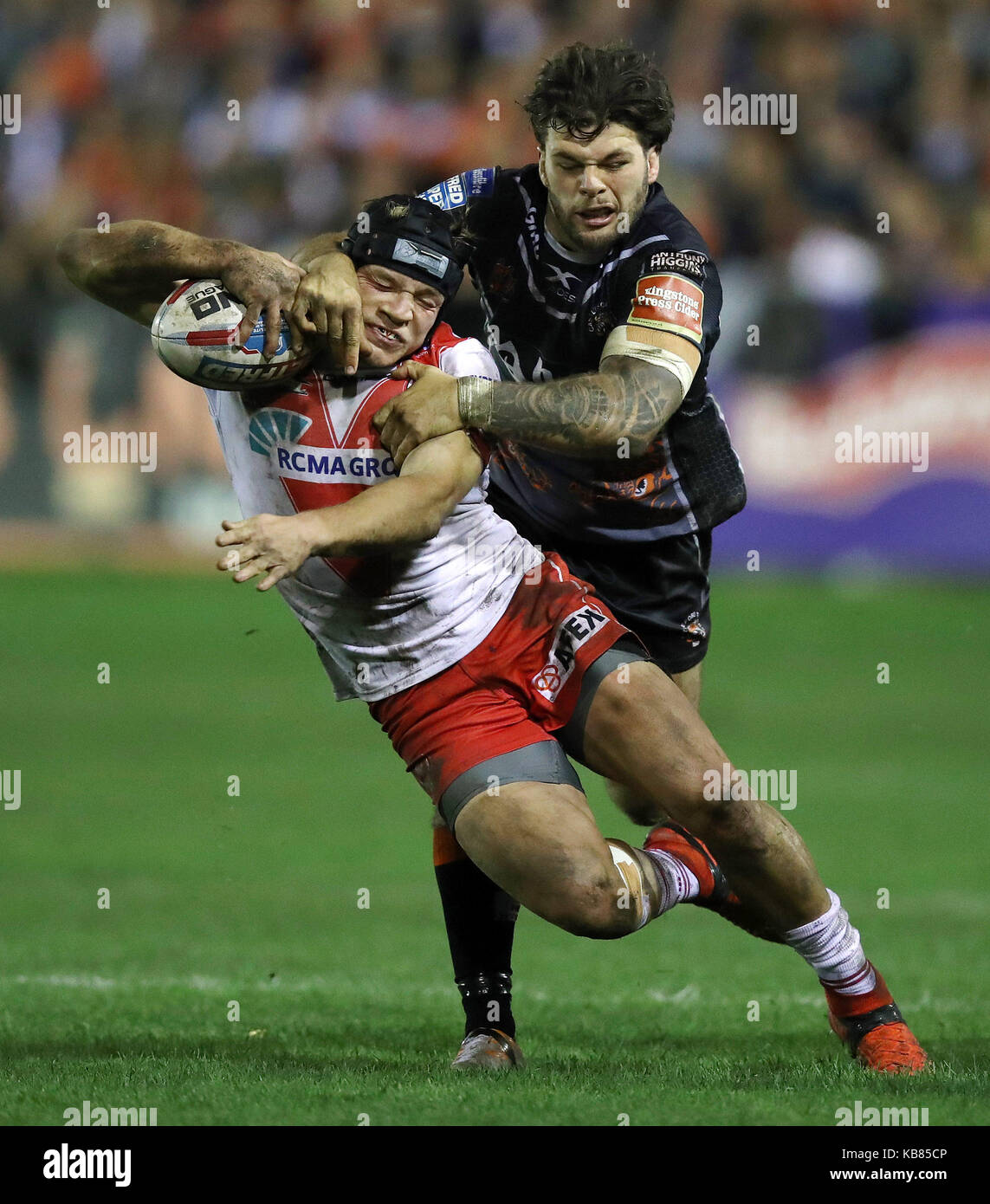 Castleford Tigers' Alex Foster tackles St Helens' Jonny Lomax during ...