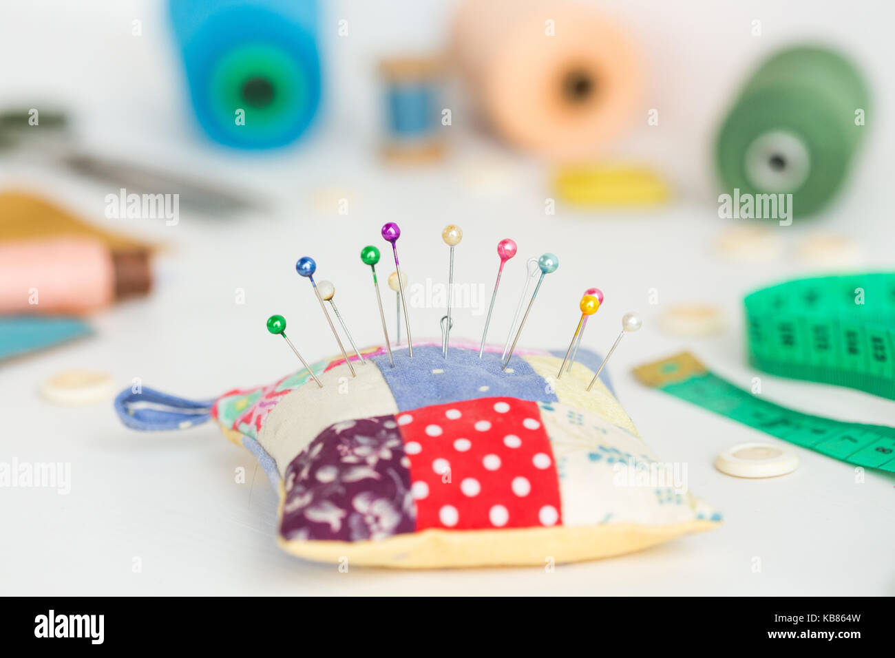 needlework, craft, sewing and tailoring concept - macro with white ...