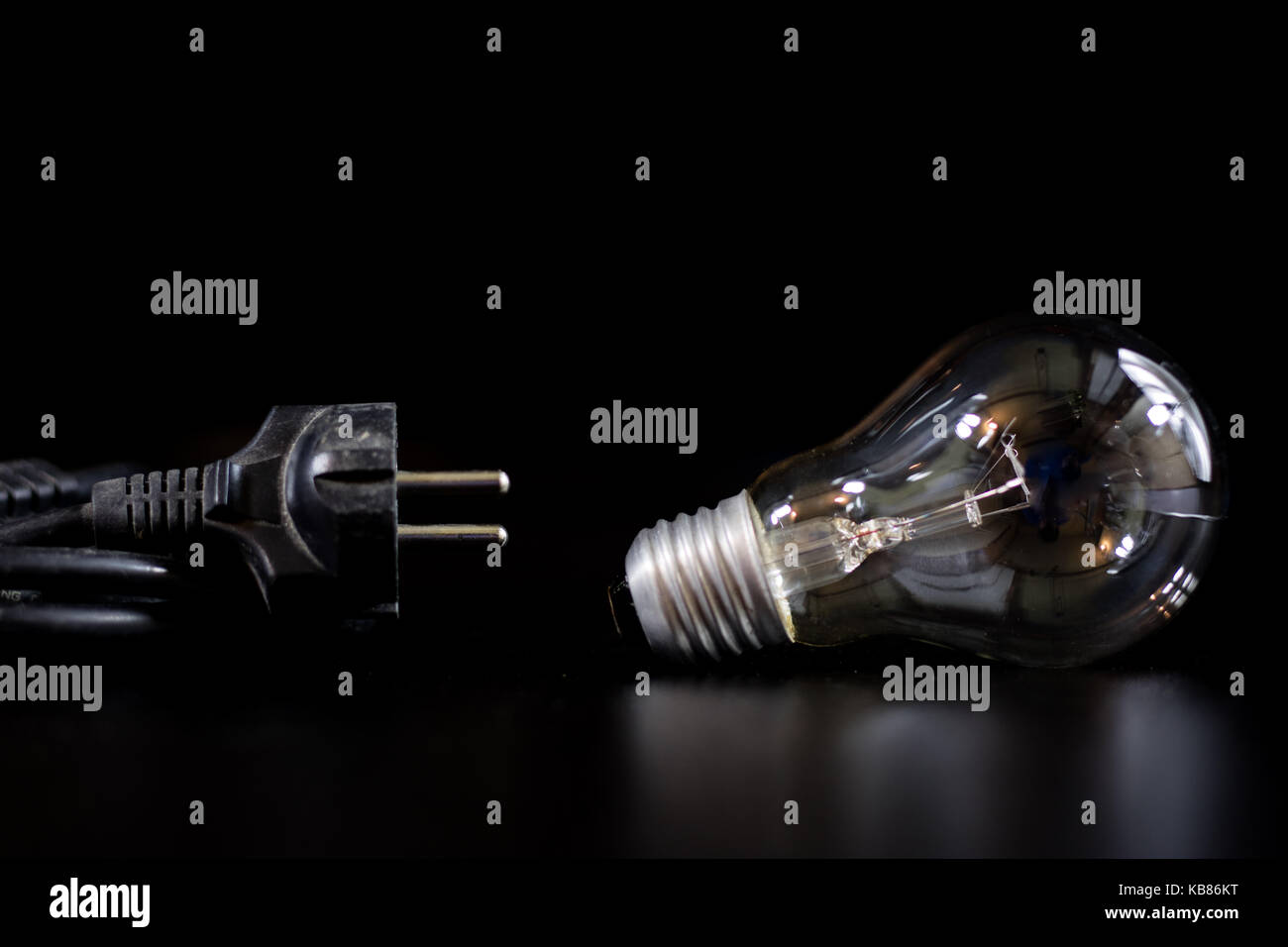 Old entangled cables, electronics and old cable connectors on a black ...