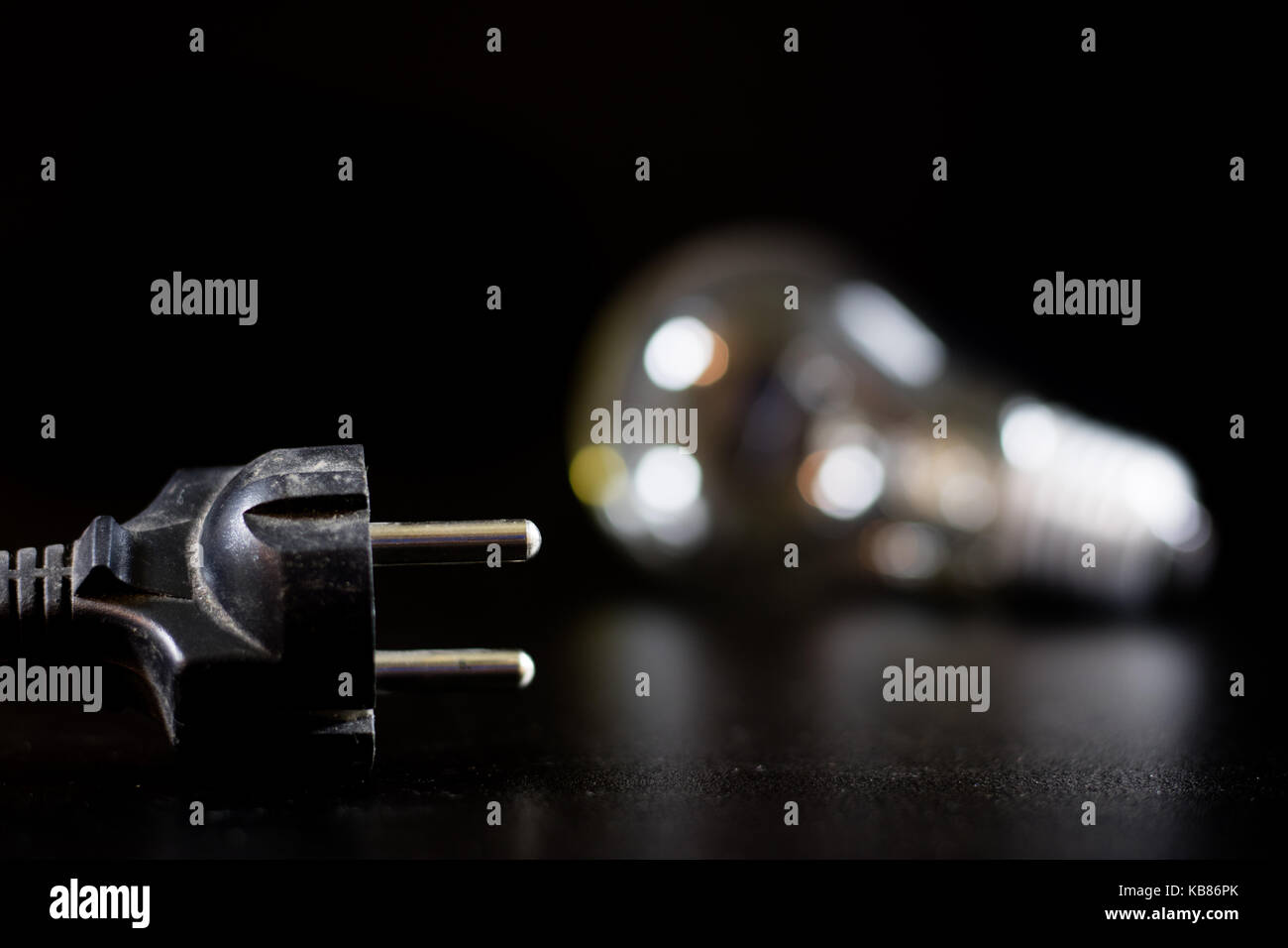 Old entangled cables, electronics and old cable connectors on a black ...