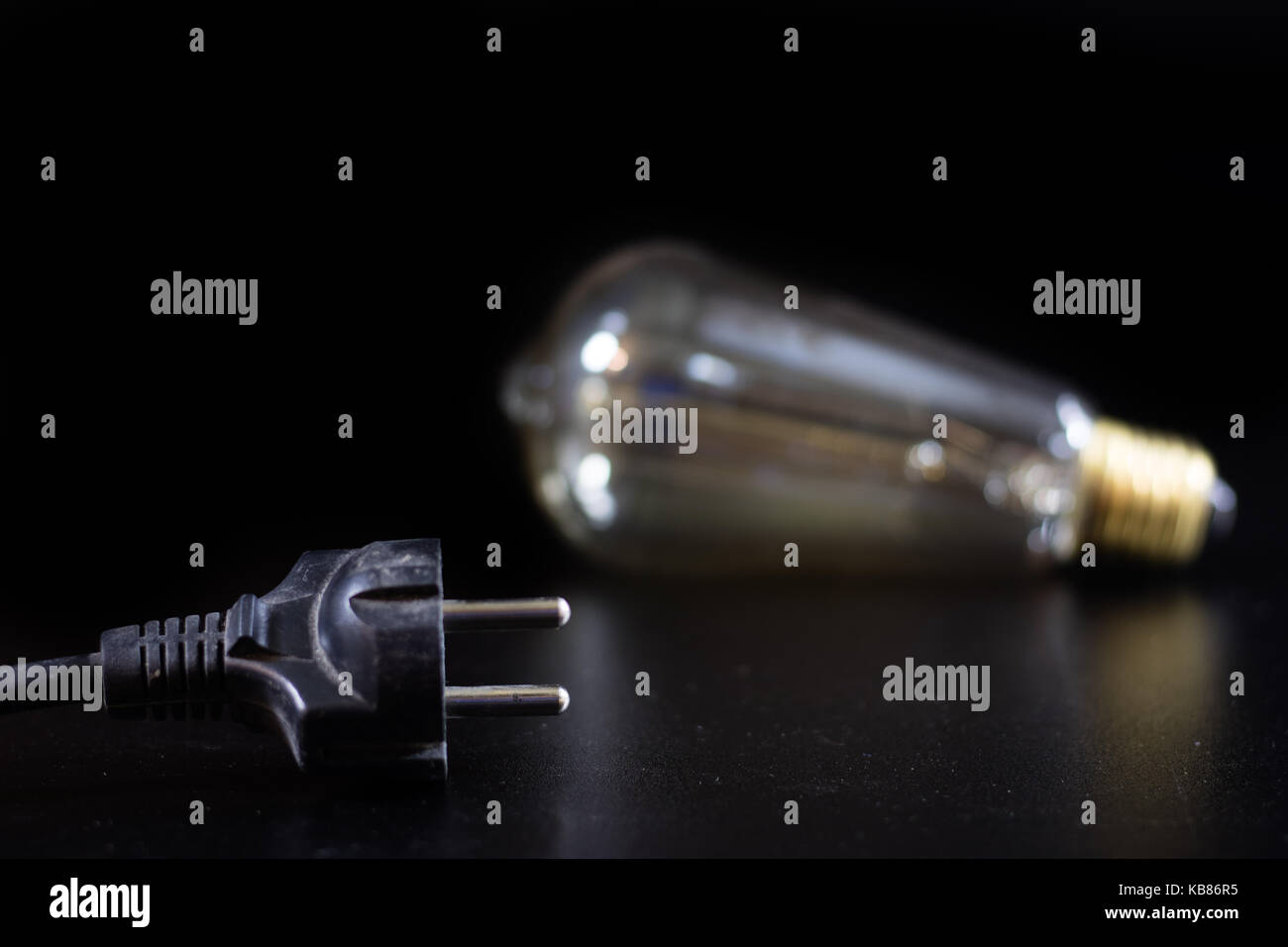 Old entangled cables, electronics and old cable connectors on a black ...