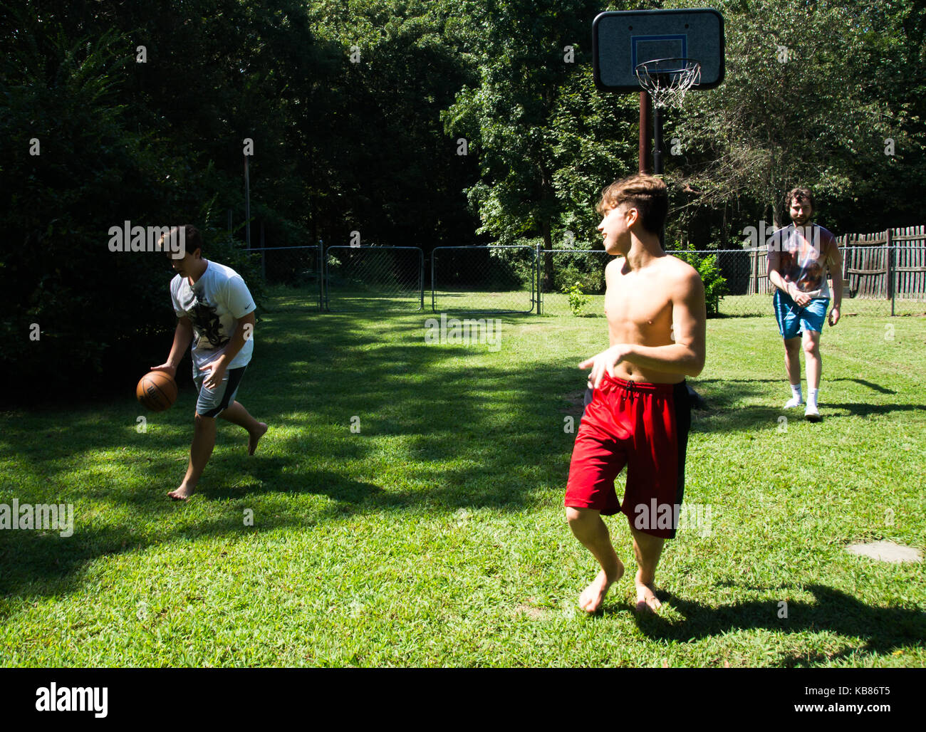 Brothers Playing Basketball Stock Photo - Alamy