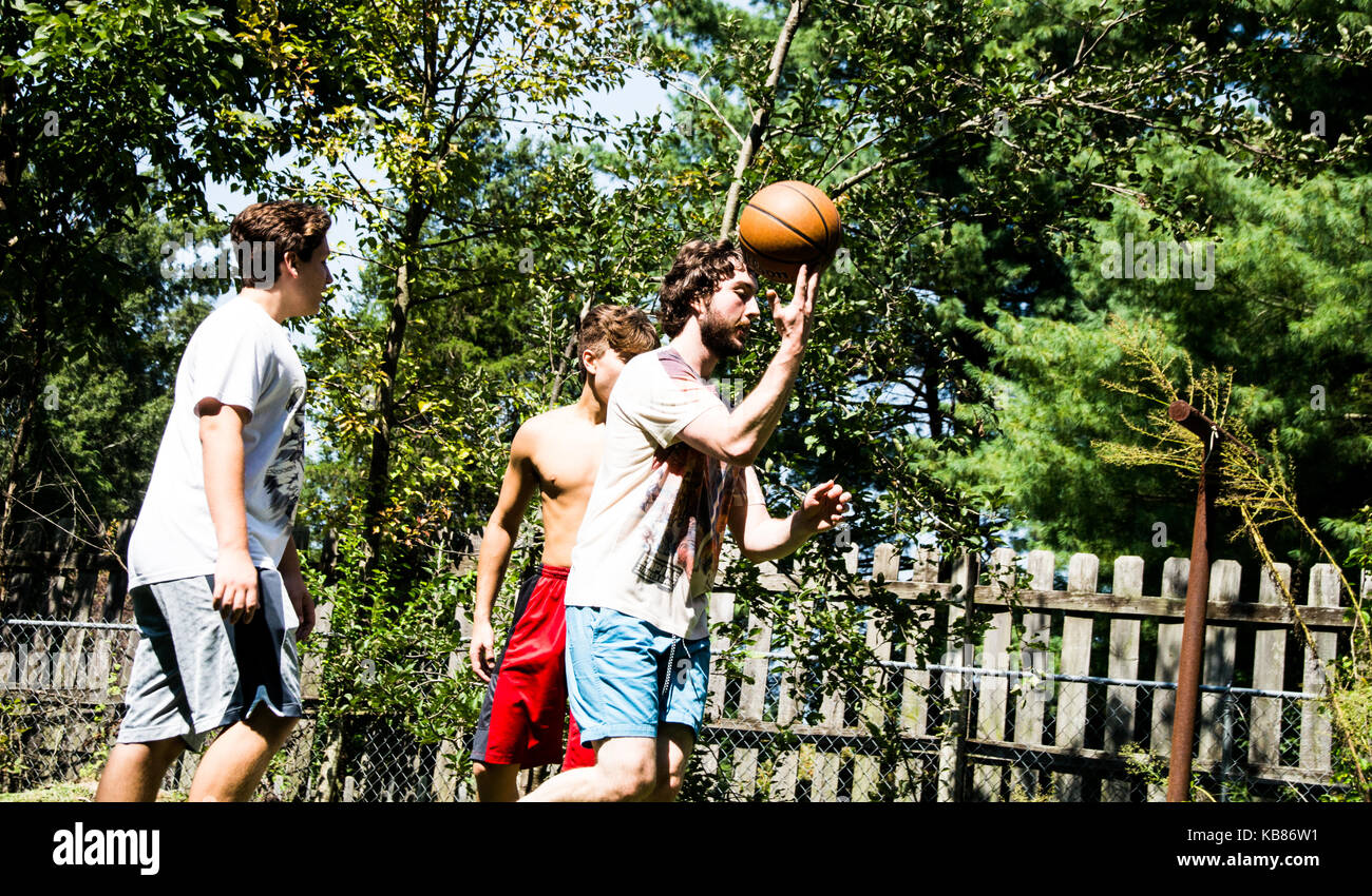 Brothers Playing Basketball Stock Photo - Alamy