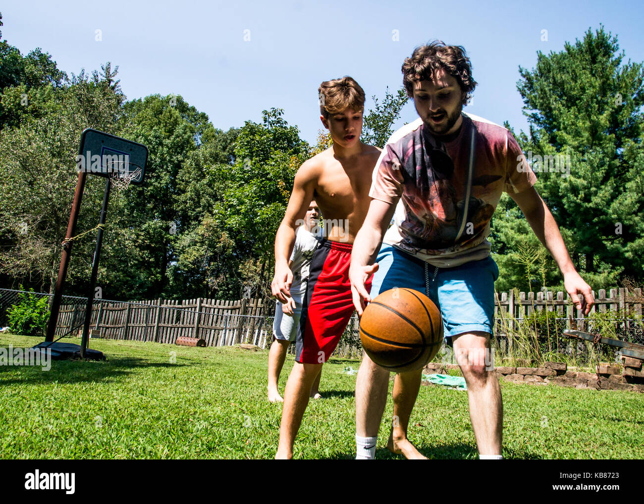 Brothers Playing Basketball Stock Photo - Alamy