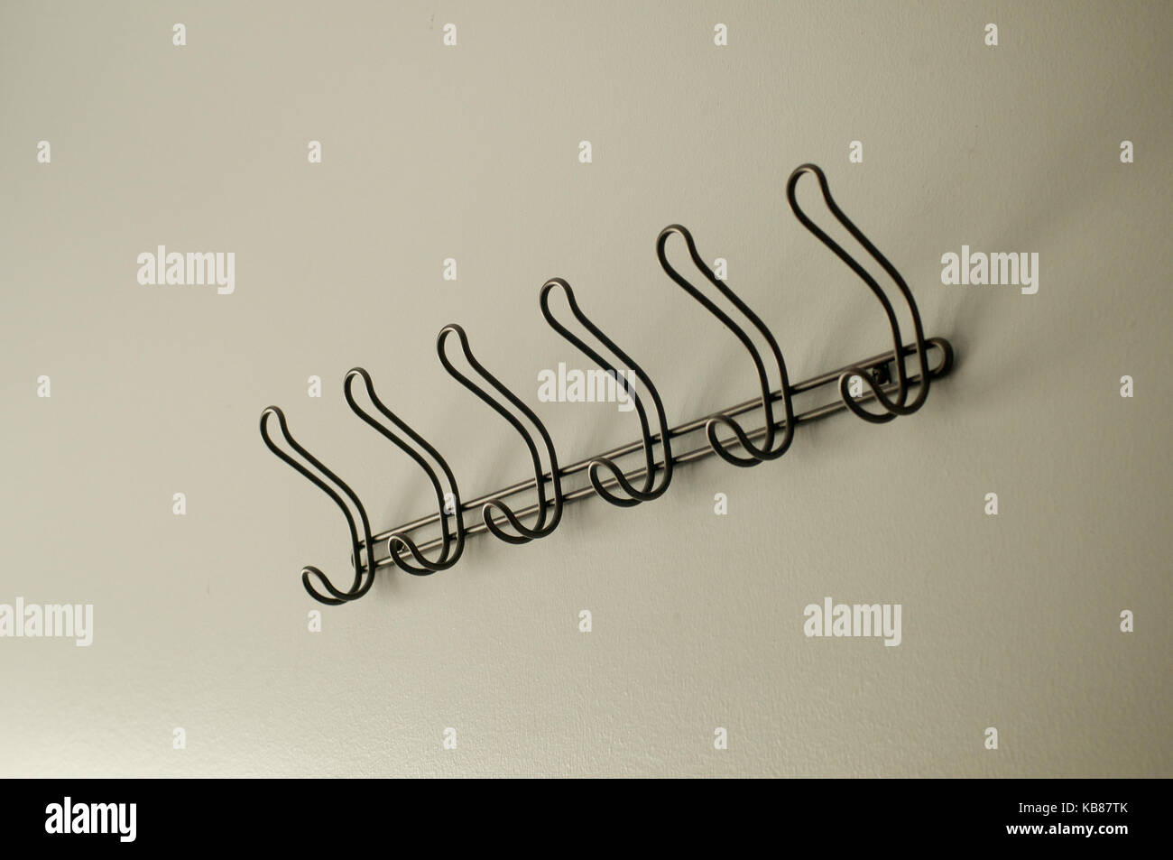 Abstract - coat hooks on a wall Stock Photo - Alamy