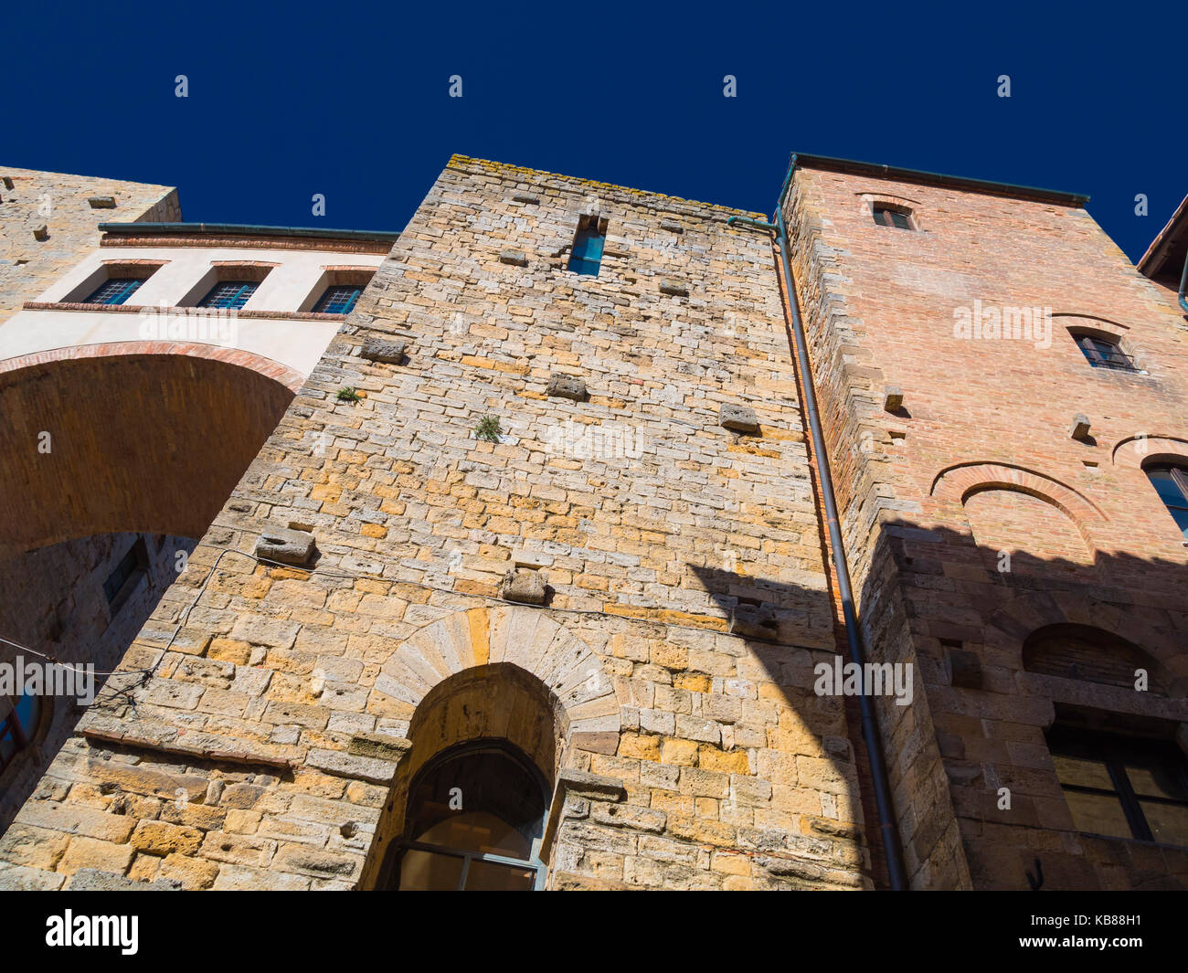 The amazing stone buildings in the historic village of Volterra in ...