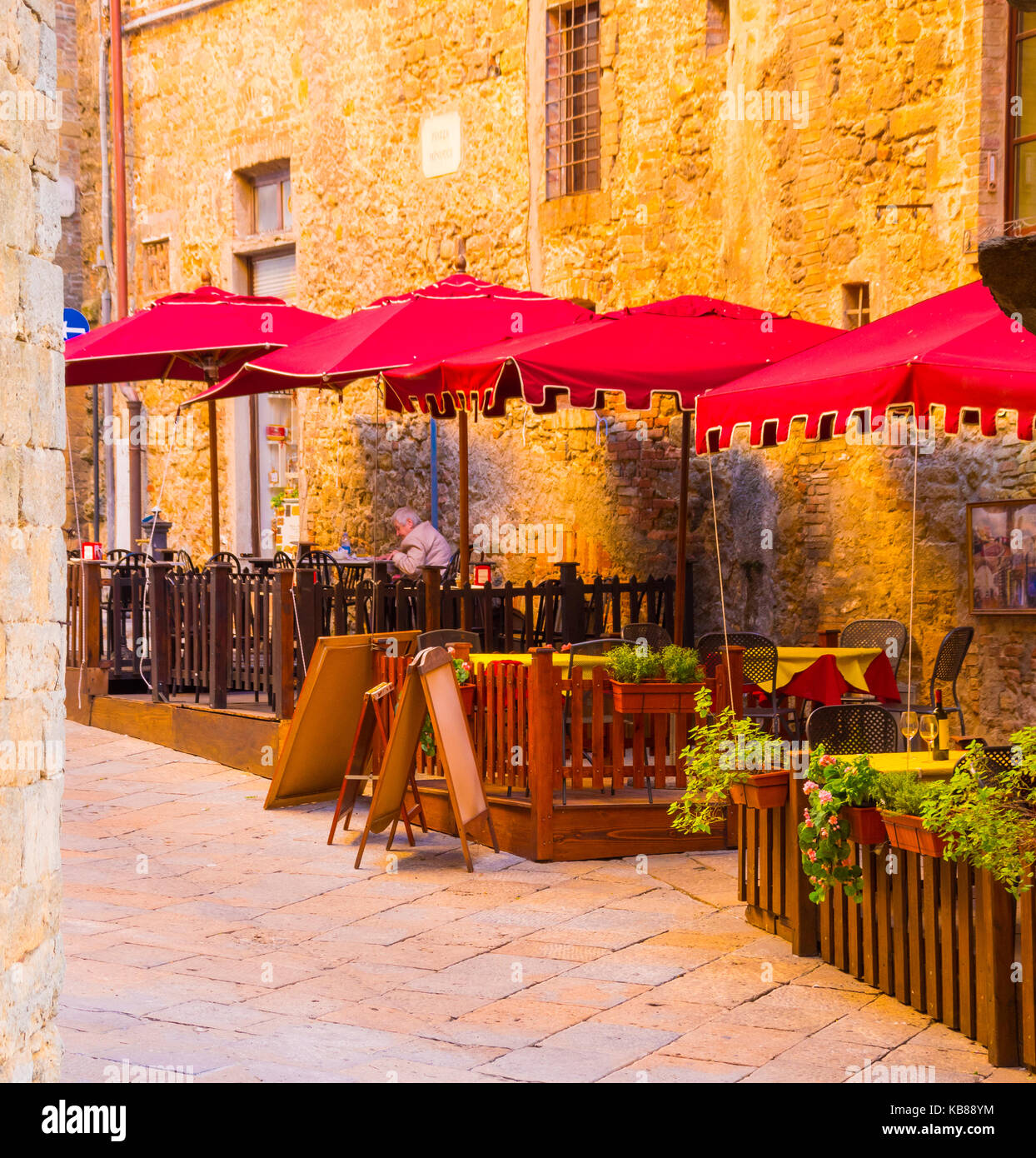 Small street restaurant in the historic district of Volterra - a ...