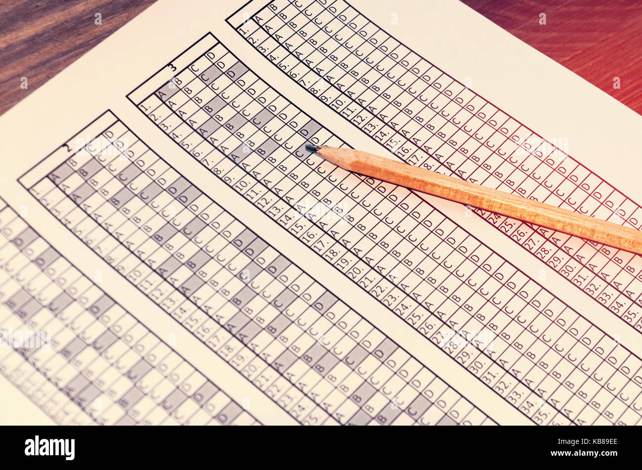 Form for the exam with the pencil lying on it. Testing. Selective focus ...