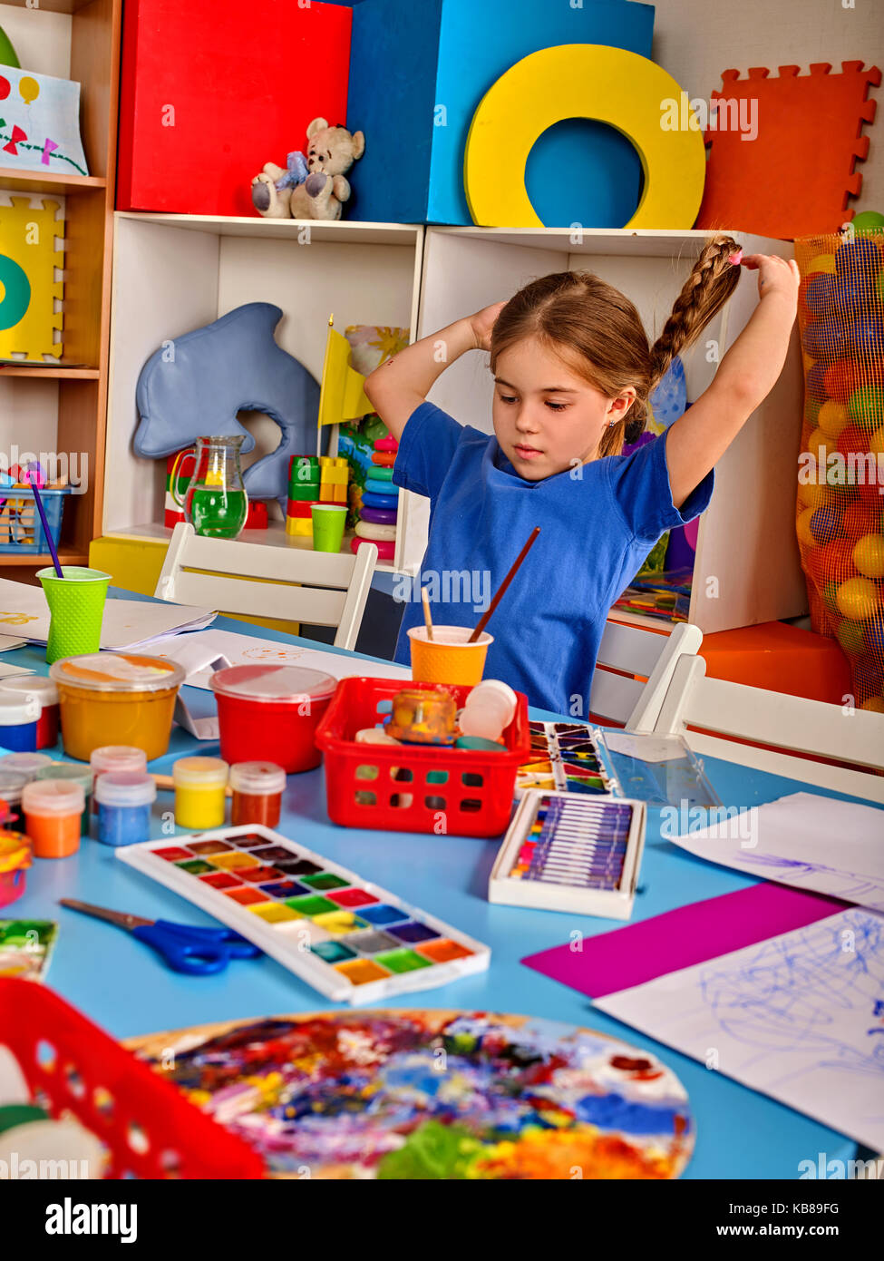 Small students girl painting in art school class Stock Photo - Alamy