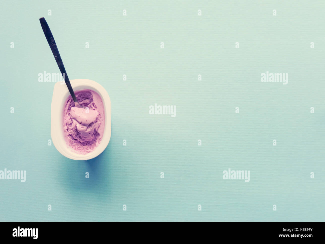 Dairy product on a blue background. Light air cottage cheese. Copy ...