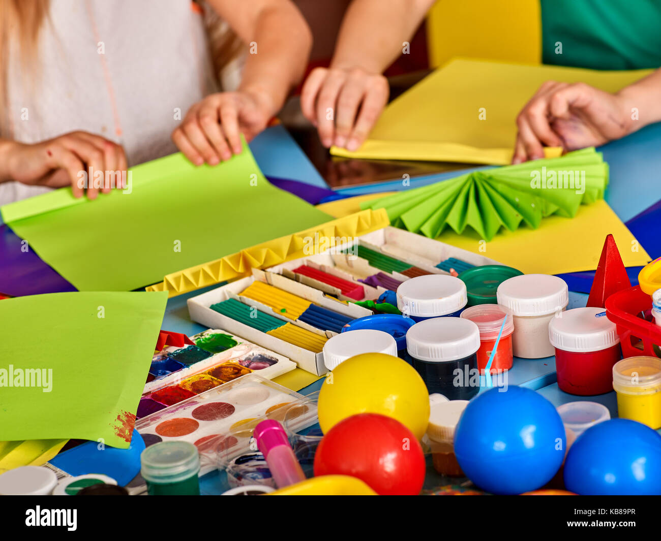 School children with scissors in kids hands cutting paper Stock Photo ...